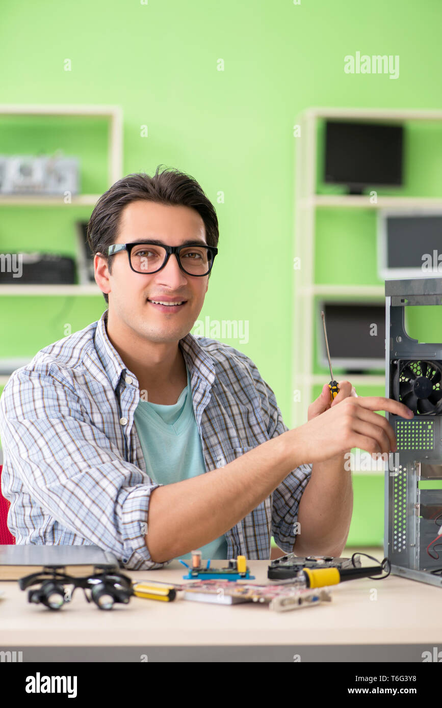 Smiling pc engineer repairing hi-res stock photography and images - Alamy