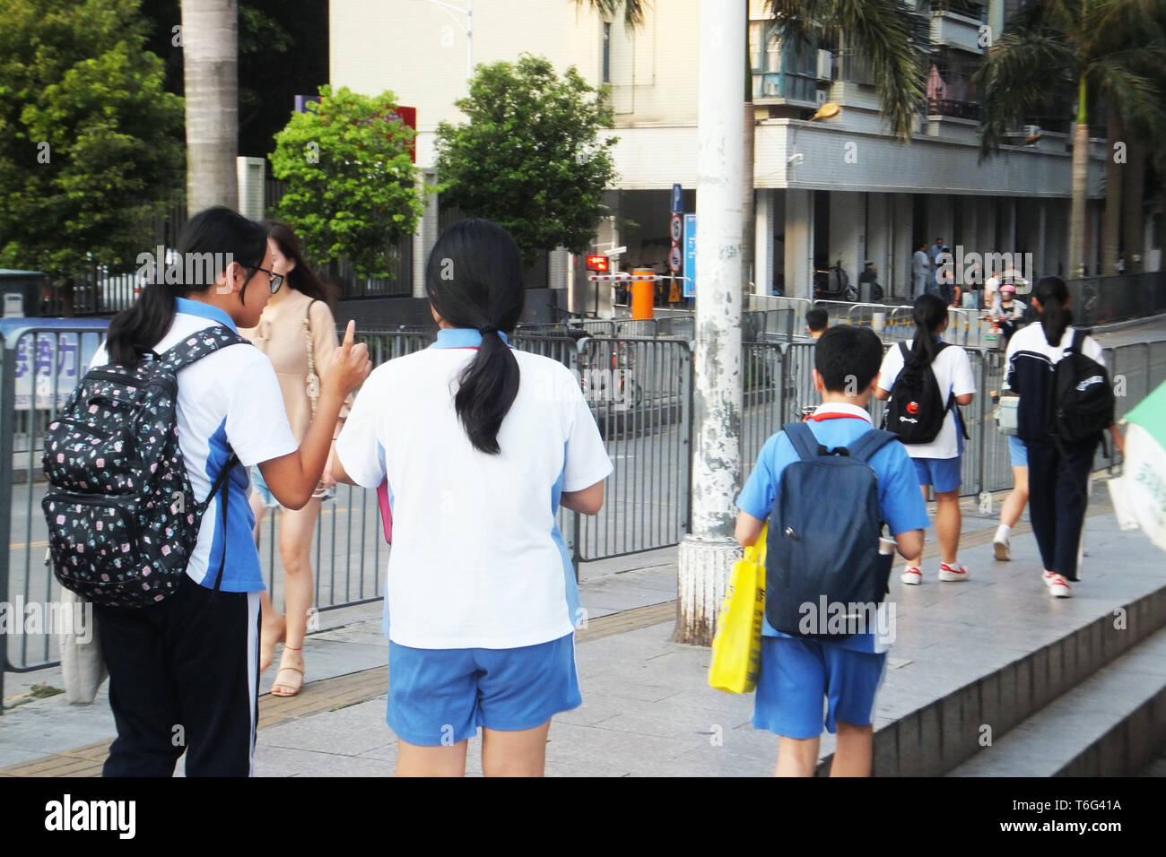 Shenzhen, China: middle school students walk home from school and buy ...