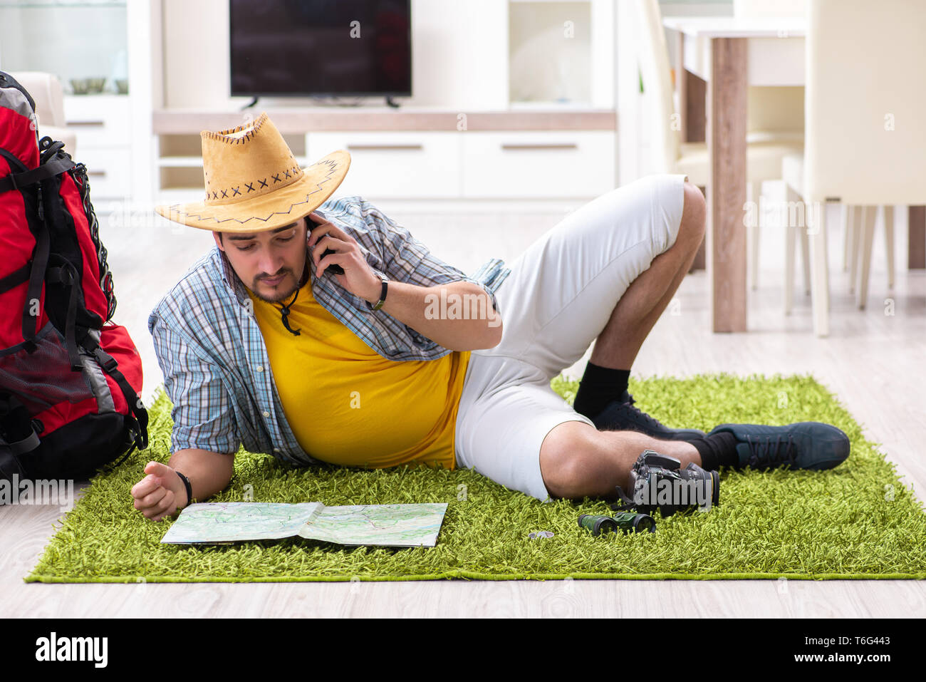 Man planning his travel with map Stock Photo - Alamy