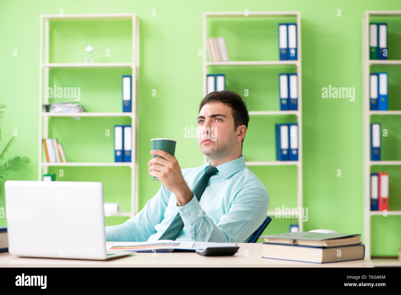 Male financial manager working in the office Stock Photo - Alamy