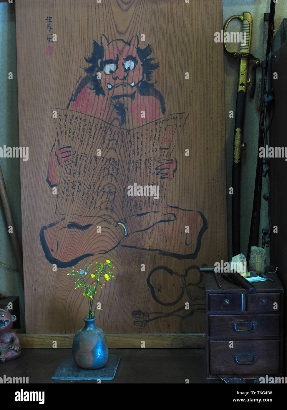 Japanese Oni, Devil reading newspaper, Kamakura, Japan Stock Photo - Alamy