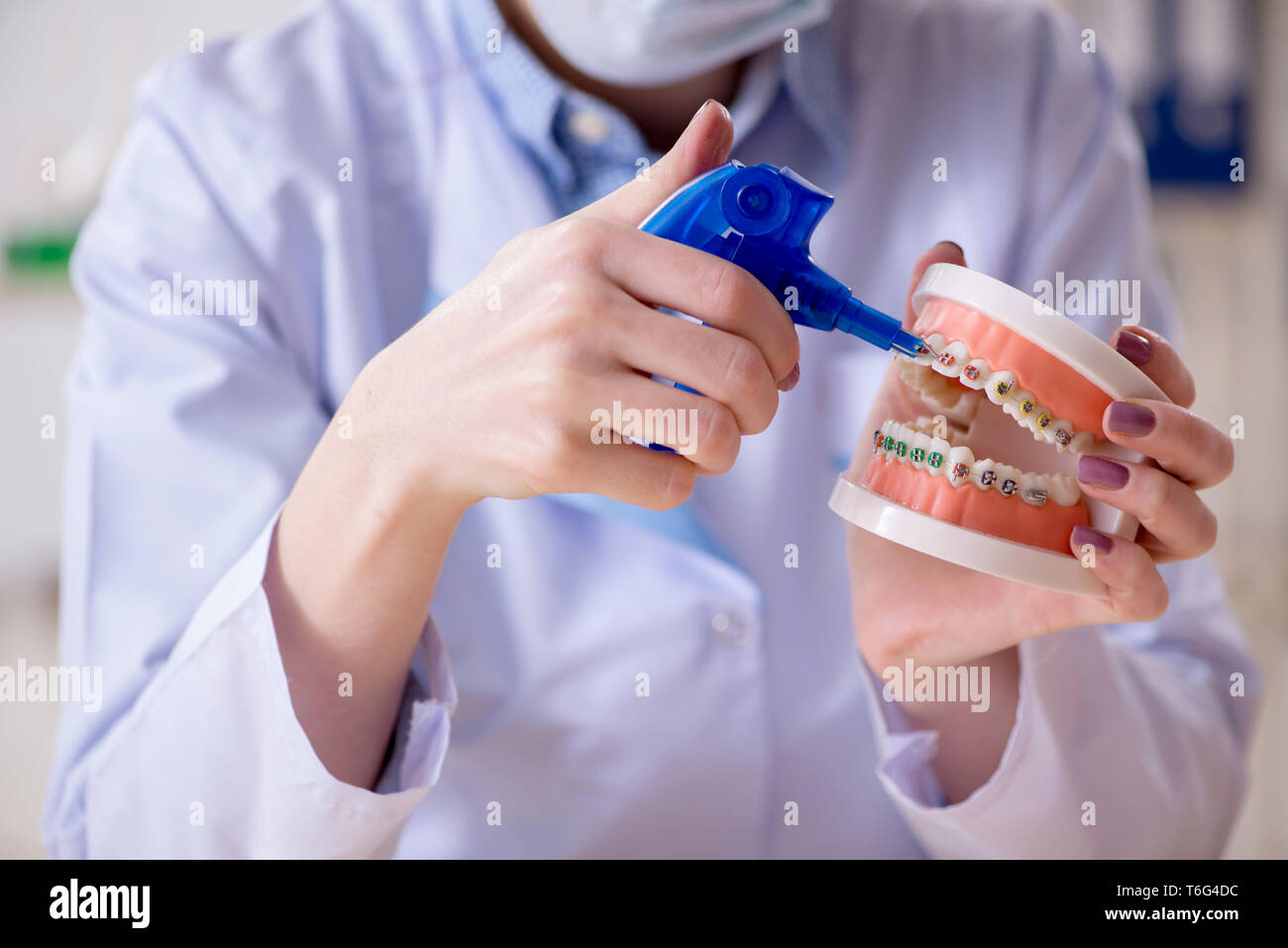 Woman dentist practicing work on tooth model Stock Photo - Alamy