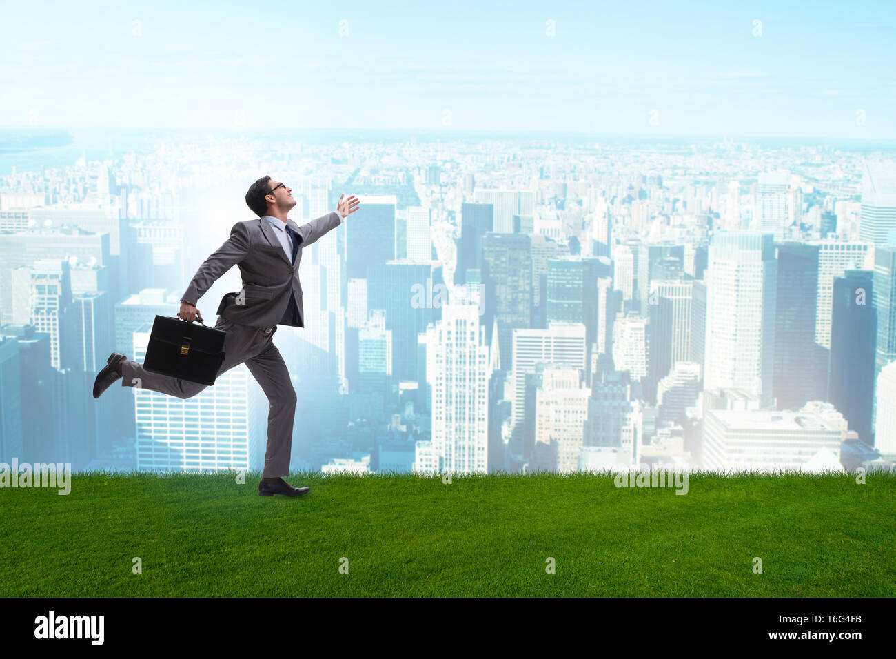 Happy businessman running towards his goal Stock Photo - Alamy
