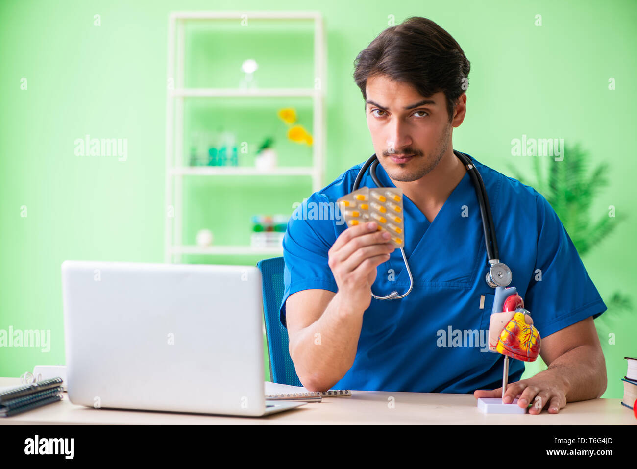 Doctor student explaining heart problems Stock Photo - Alamy