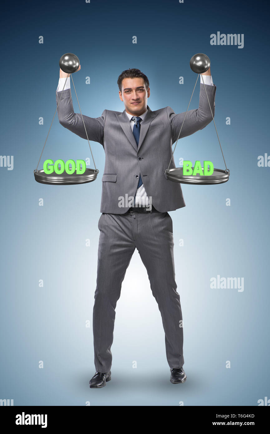 Businessman choosing between good and bad Stock Photo - Alamy
