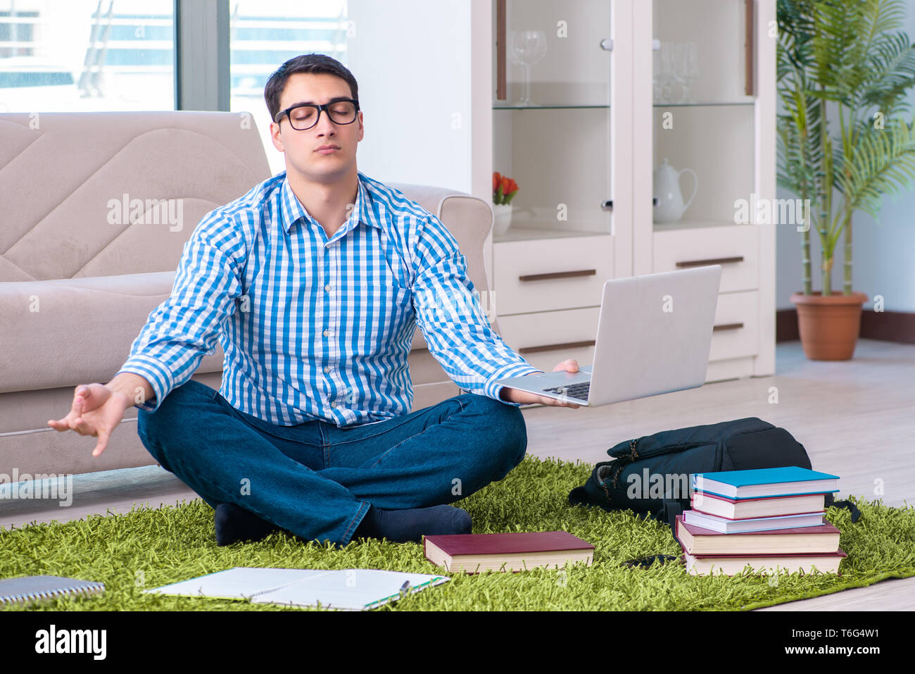 Student meditating and preparing for university exams Stock Photo - Alamy
