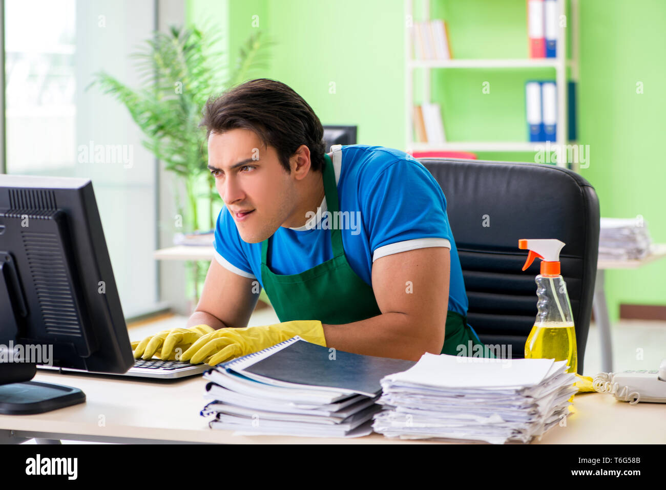 Hacker under professional cleaner cover stealing personal data Stock ...