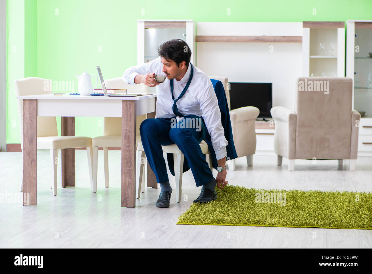 Man dressing up and late for work Stock Photo - Alamy