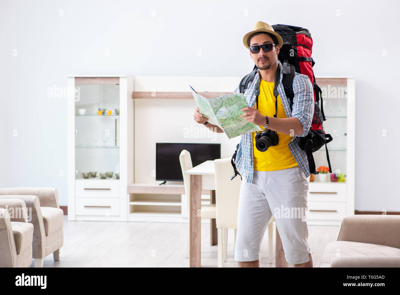 Man planning his travel with map Stock Photo - Alamy