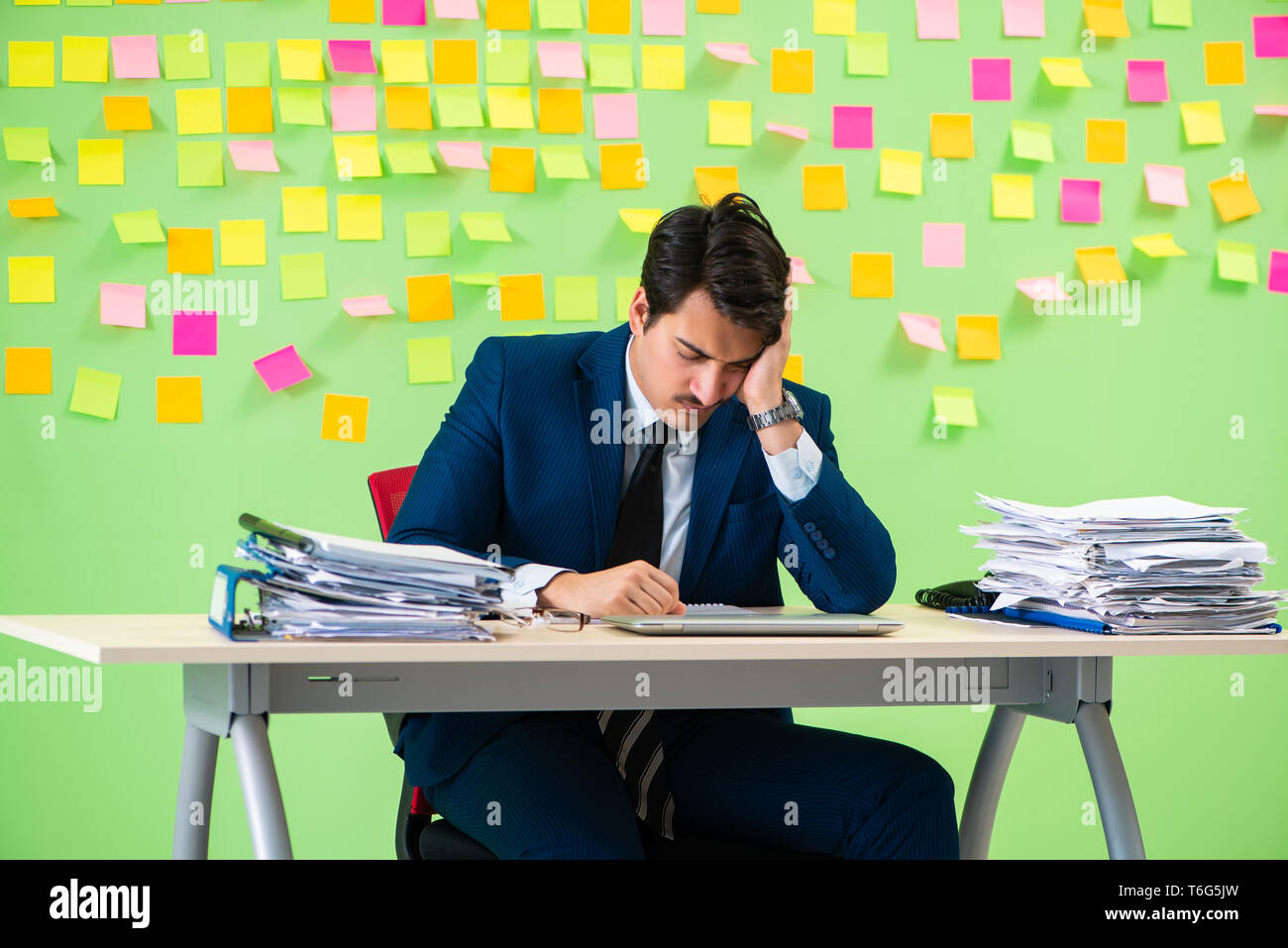 Businessman having trouble with his priorities Stock Photo - Alamy