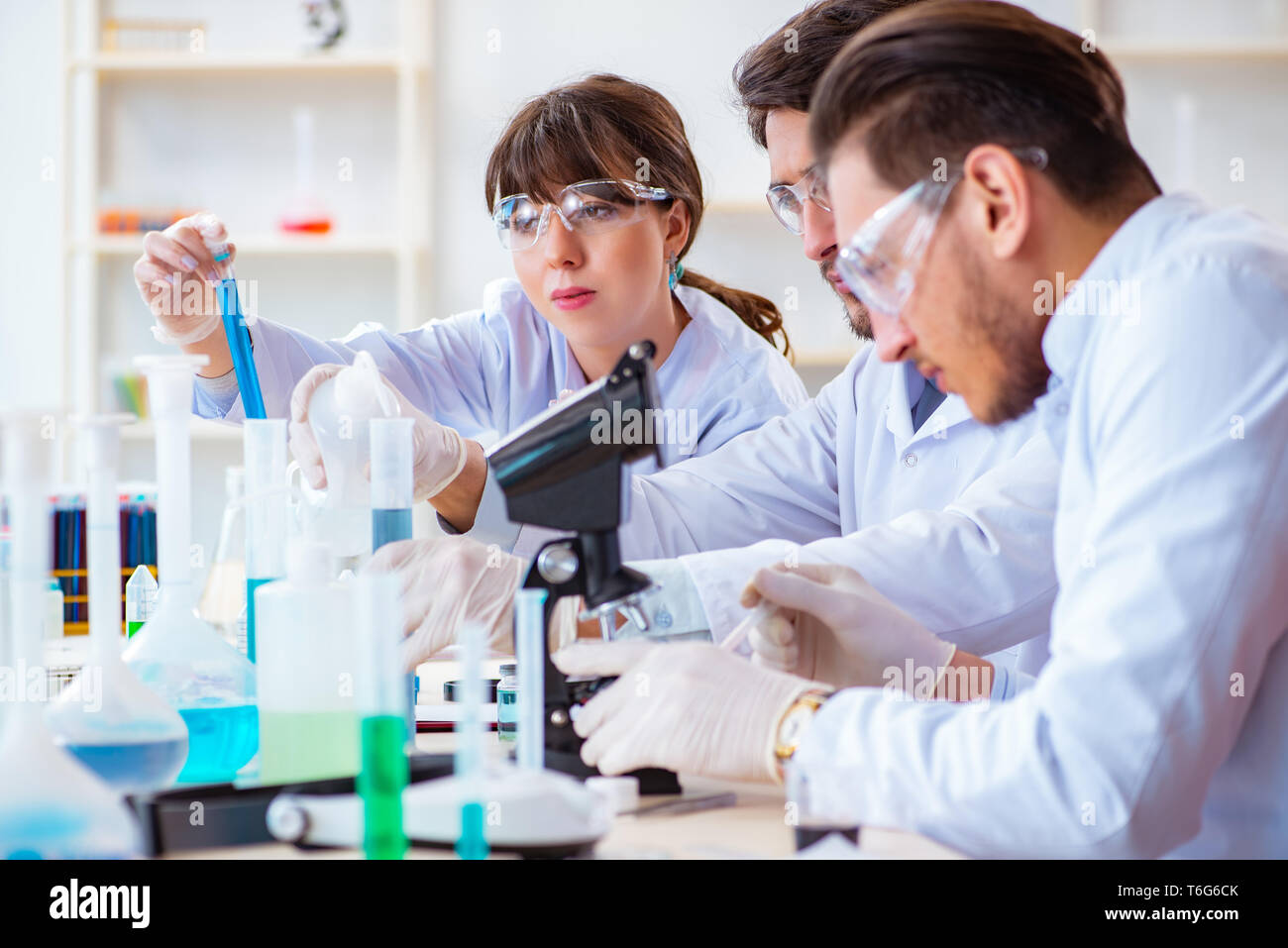 Team chemists working in hi-res stock photography and images - Alamy