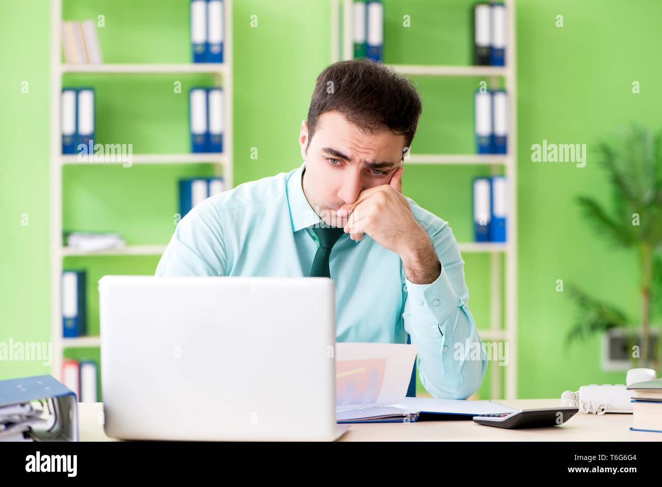 Male financial manager working in the office Stock Photo - Alamy