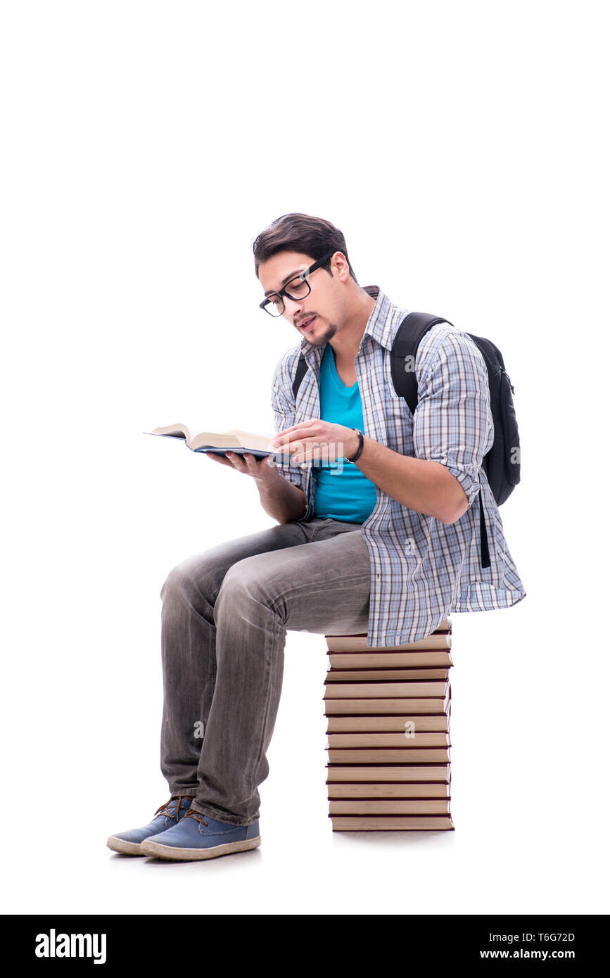 Young student sitting on top of book stack on white Stock Photo - Alamy