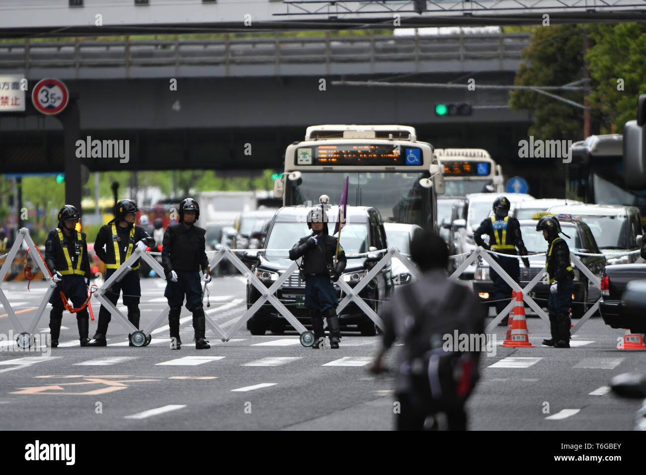 Tokyo, Japan. 1st May, 2019. Riot police close a road as part of a ...