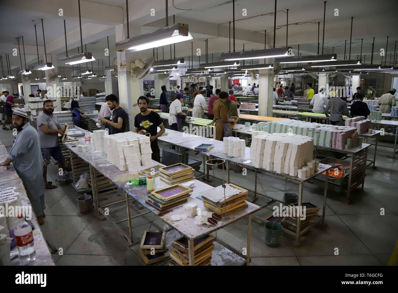 Sialkot. 12th Apr, 2019. Photo taken on April 12, 2019 shows workers ...