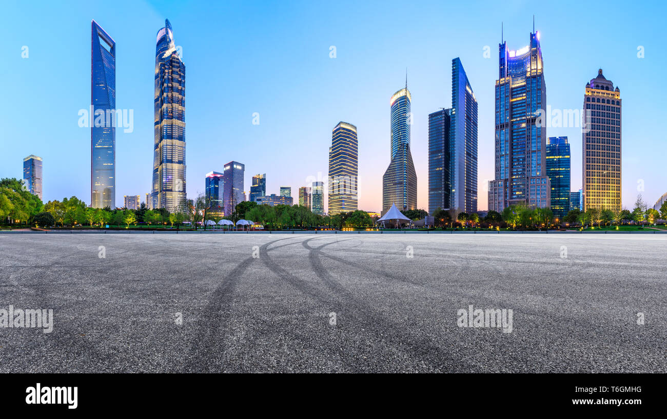 Asphalt race track ground and modern skyline and buildings in Shanghai ...