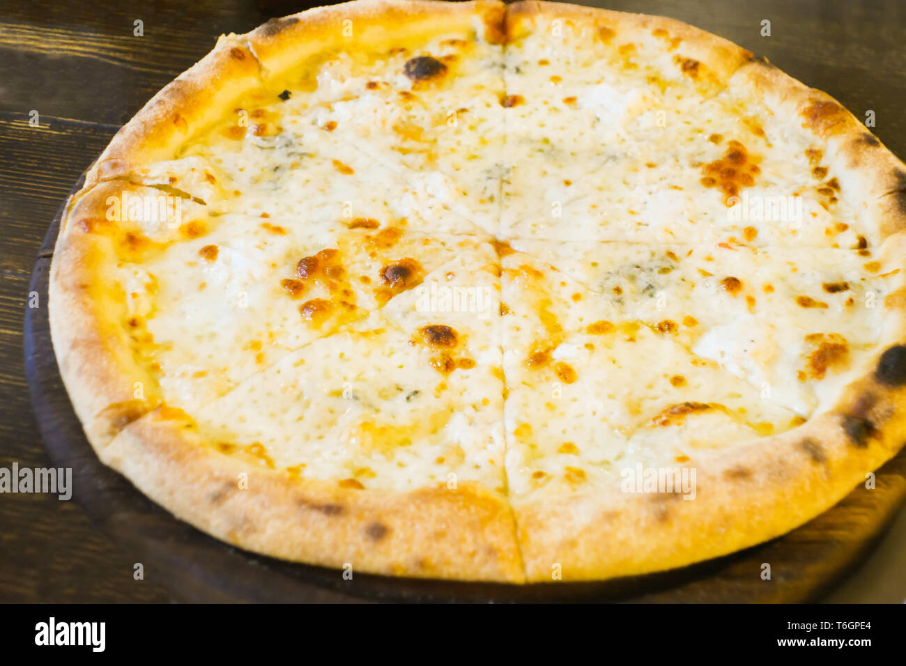 Sliced italian pizza with cheese Stock Photo - Alamy