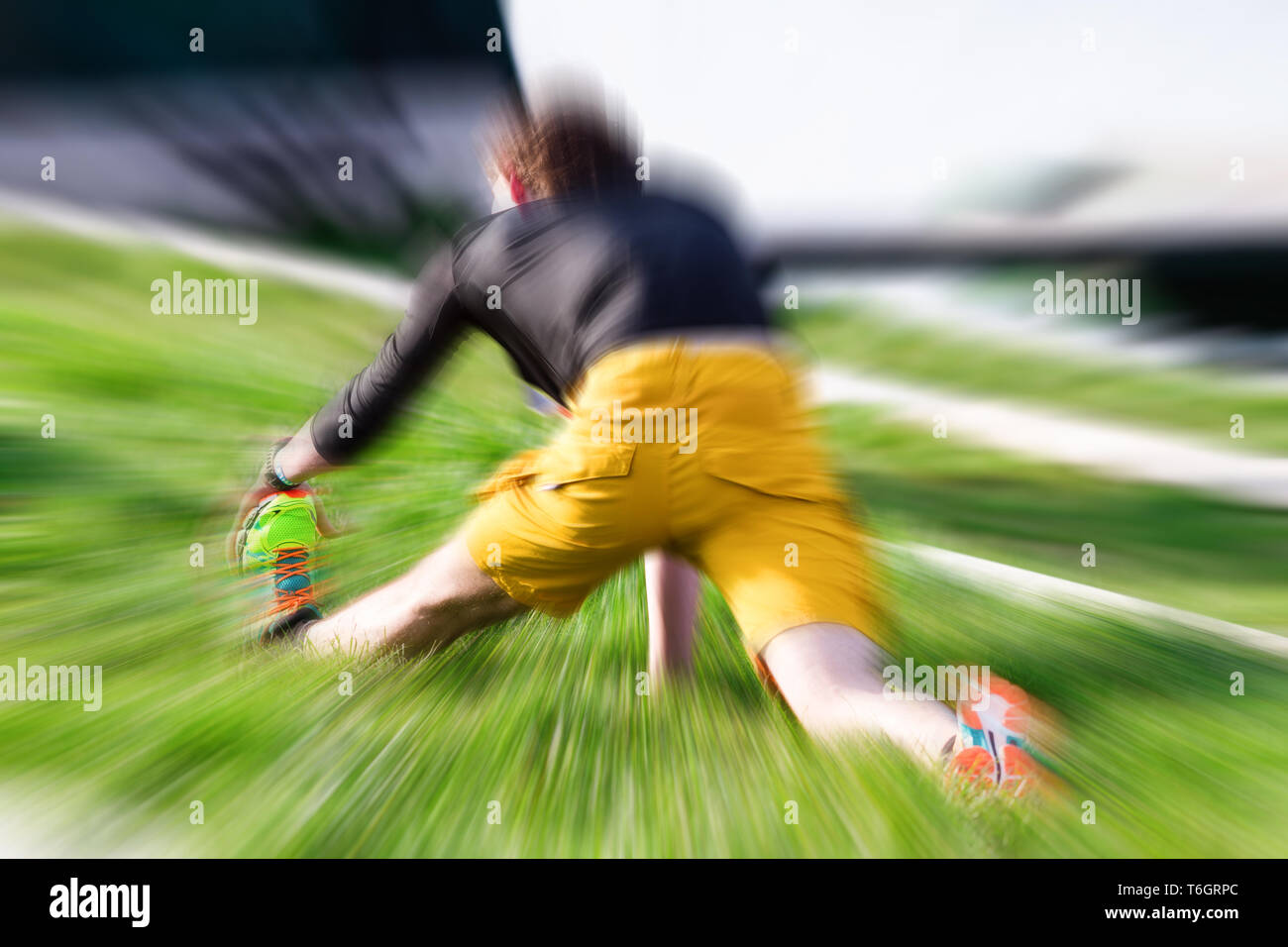 Warm up for the marathon with stretching Stock Photo - Alamy