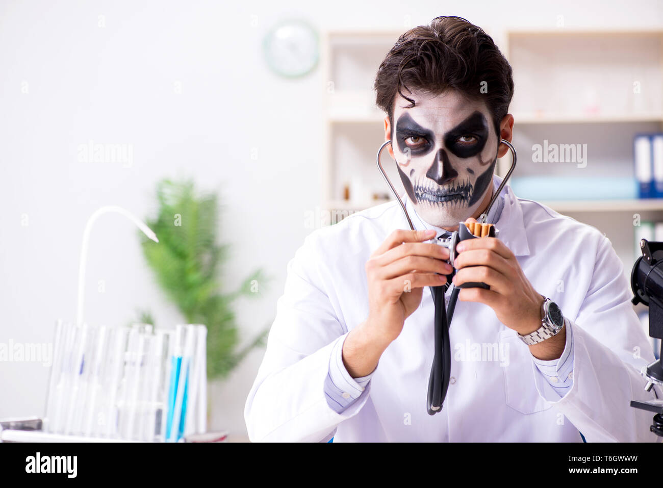 Scary monster doctor working in lab Stock Photo - Alamy