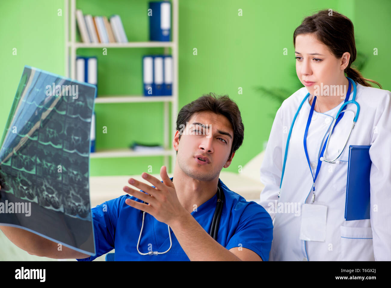 Woman and man gynecologists discussing medical case at the clini Stock ...