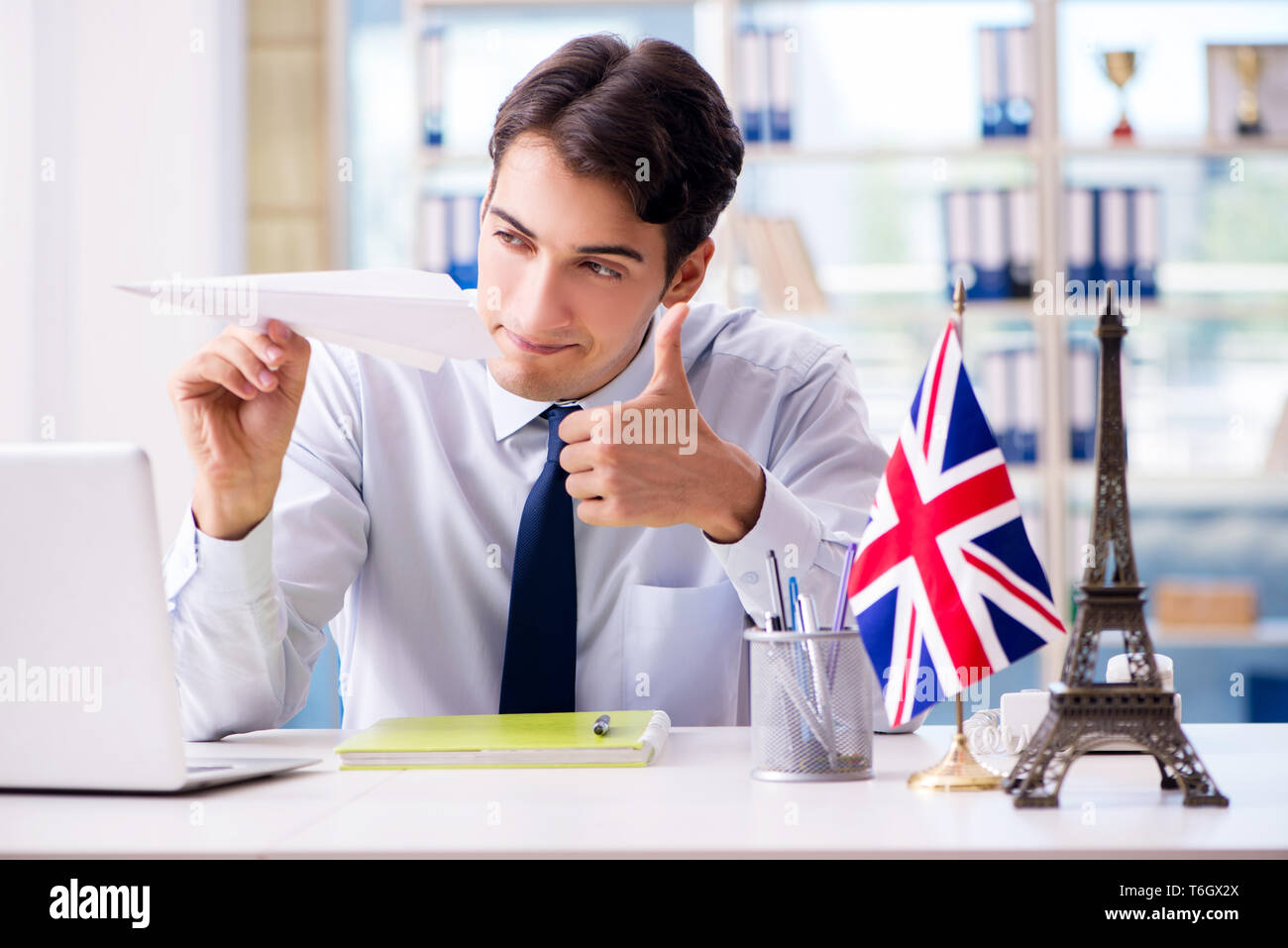Sales agent working in travel agency Stock Photo - Alamy