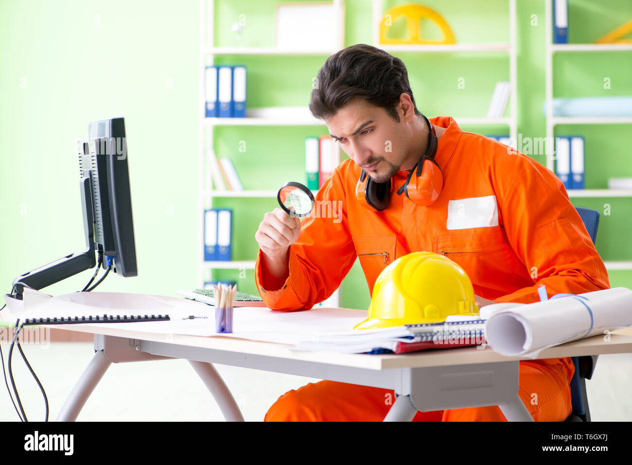 Construction supervisor planning new project in office Stock Photo - Alamy