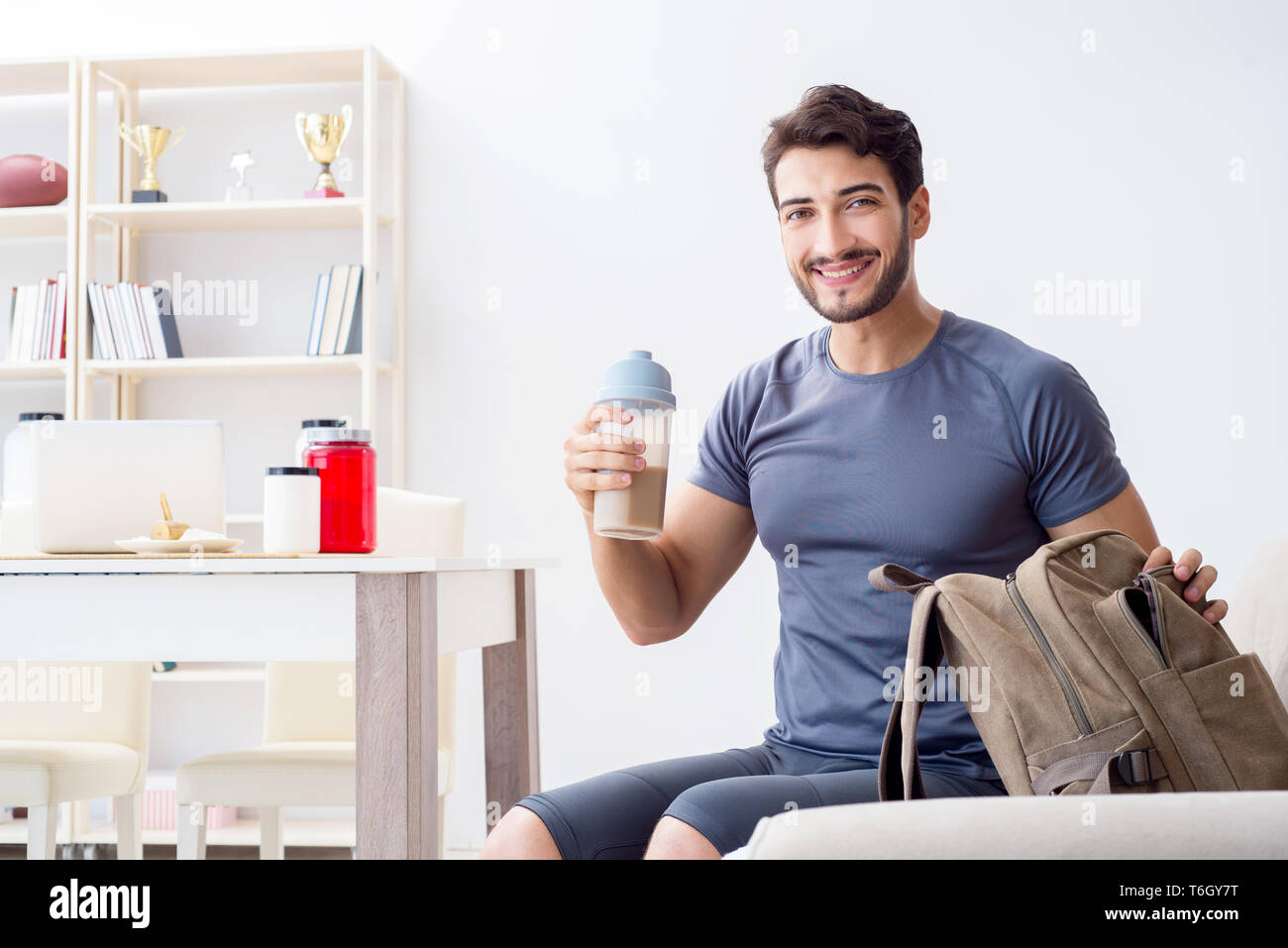 Young man getting ready for gym sports Stock Photo - Alamy