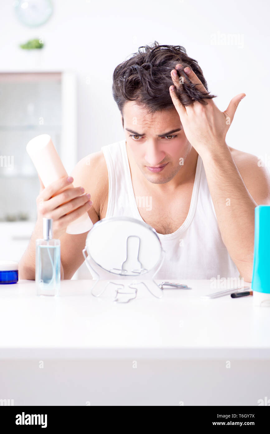Man staring at reflection in mirror hi-res stock photography and images ...