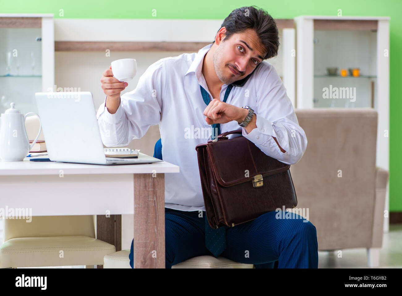 Man dressing up and late for work Stock Photo - Alamy
