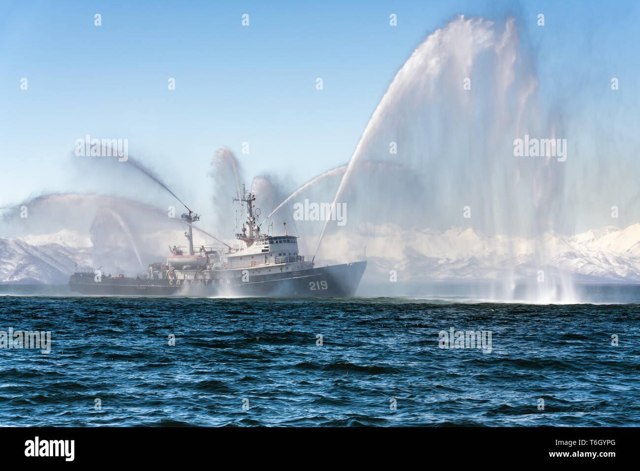 Firefighting rescue ship of Pacific Fleet of Russia spraying water on ...