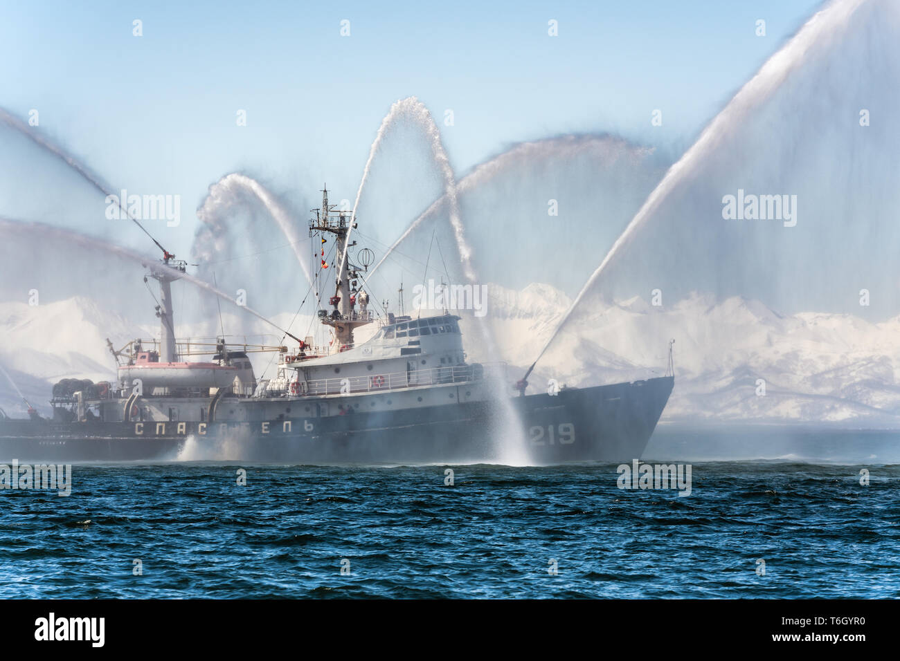 Fire fighting and rescue ship of Pacific Fleet of Russia spraying water ...