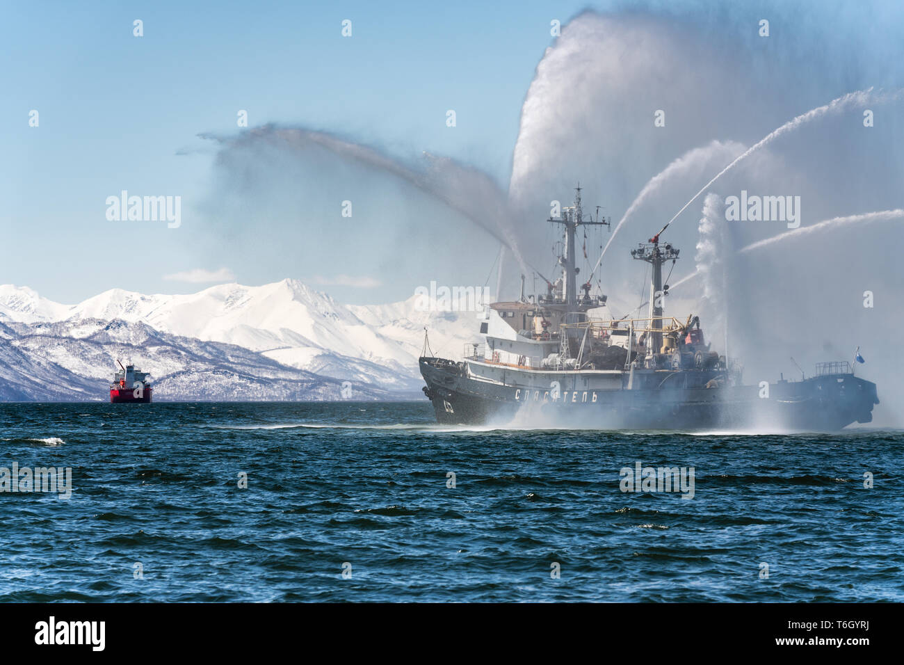 Fire fighting and rescue ship of Pacific Fleet of Russia spraying water ...
