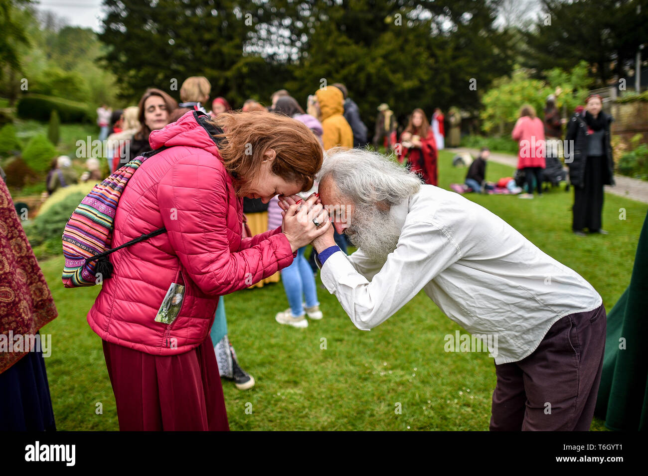 People hold hands during the Beltane celebrations at Glastonbury ...