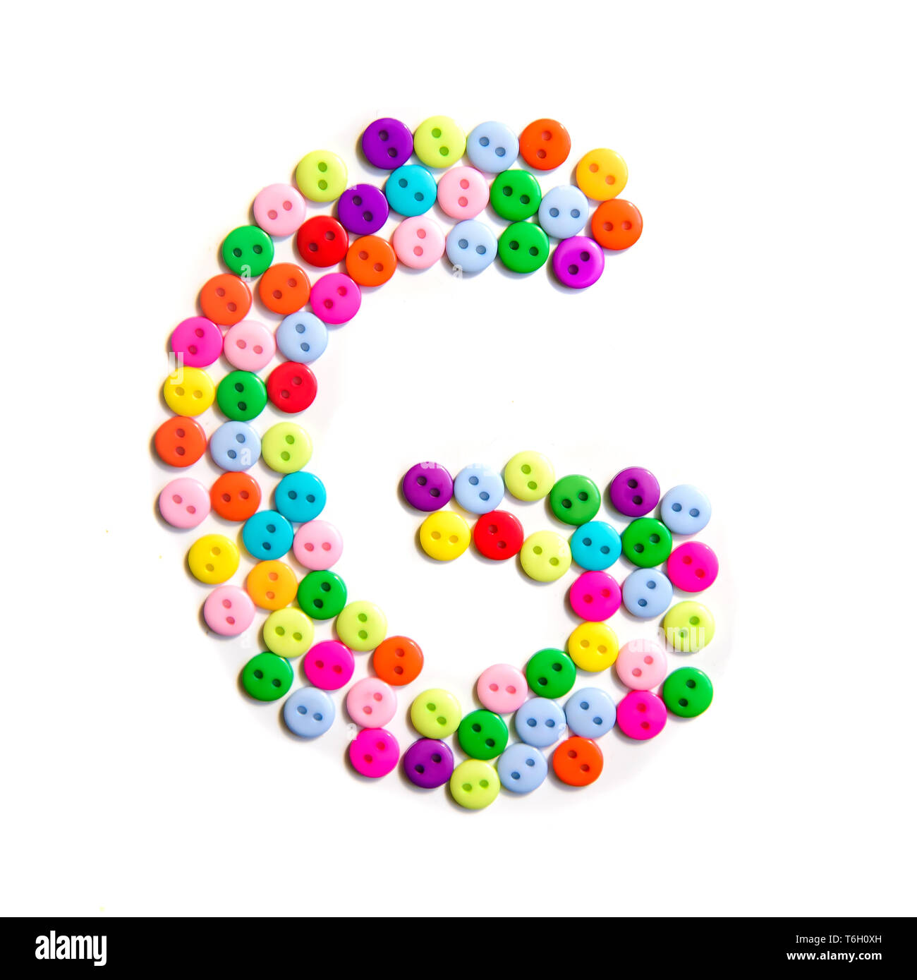 Letter G of the English alphabet from a group of colorful small buttons ...