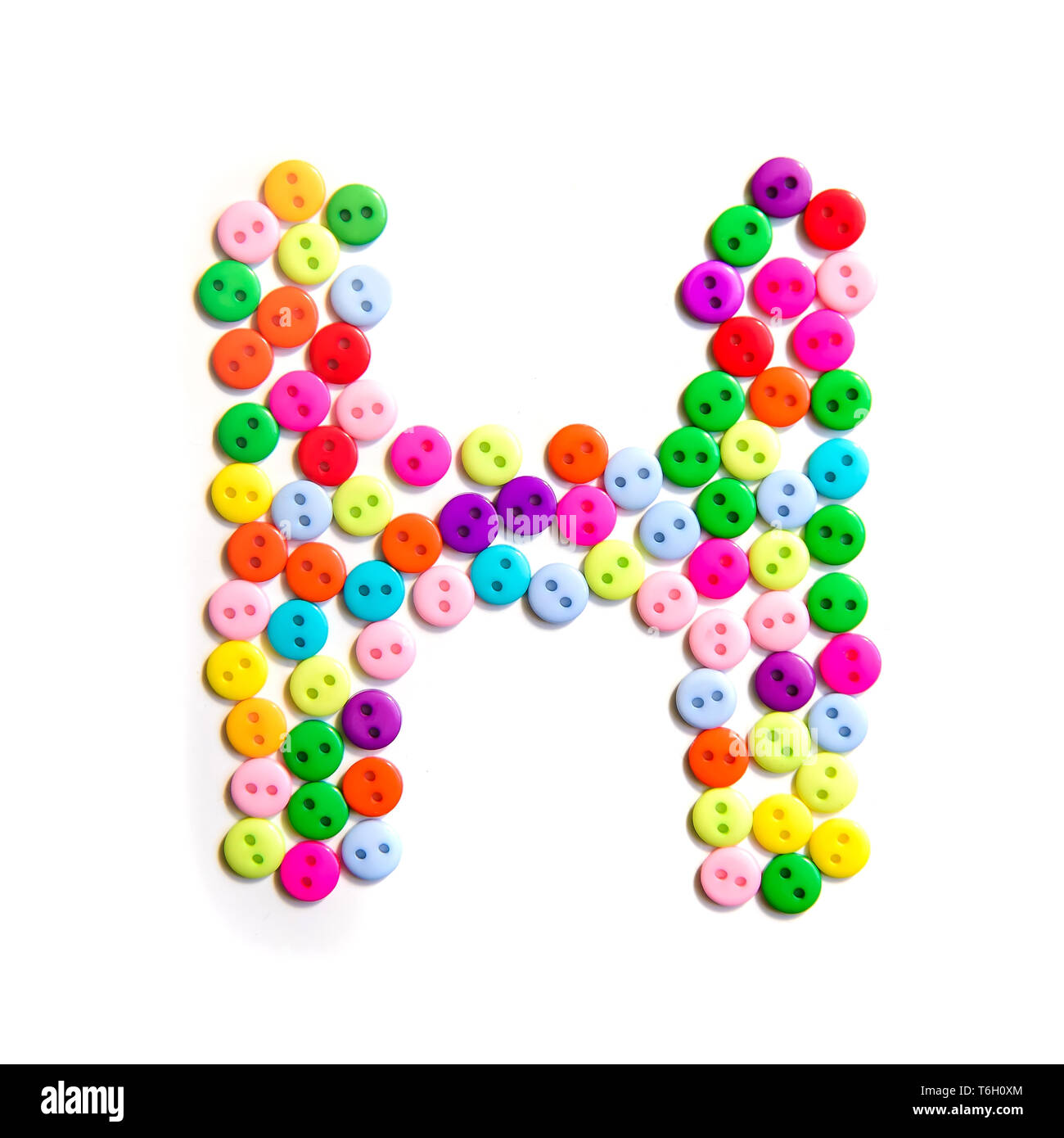 Letter H of the English alphabet from a group of colorful small buttons ...