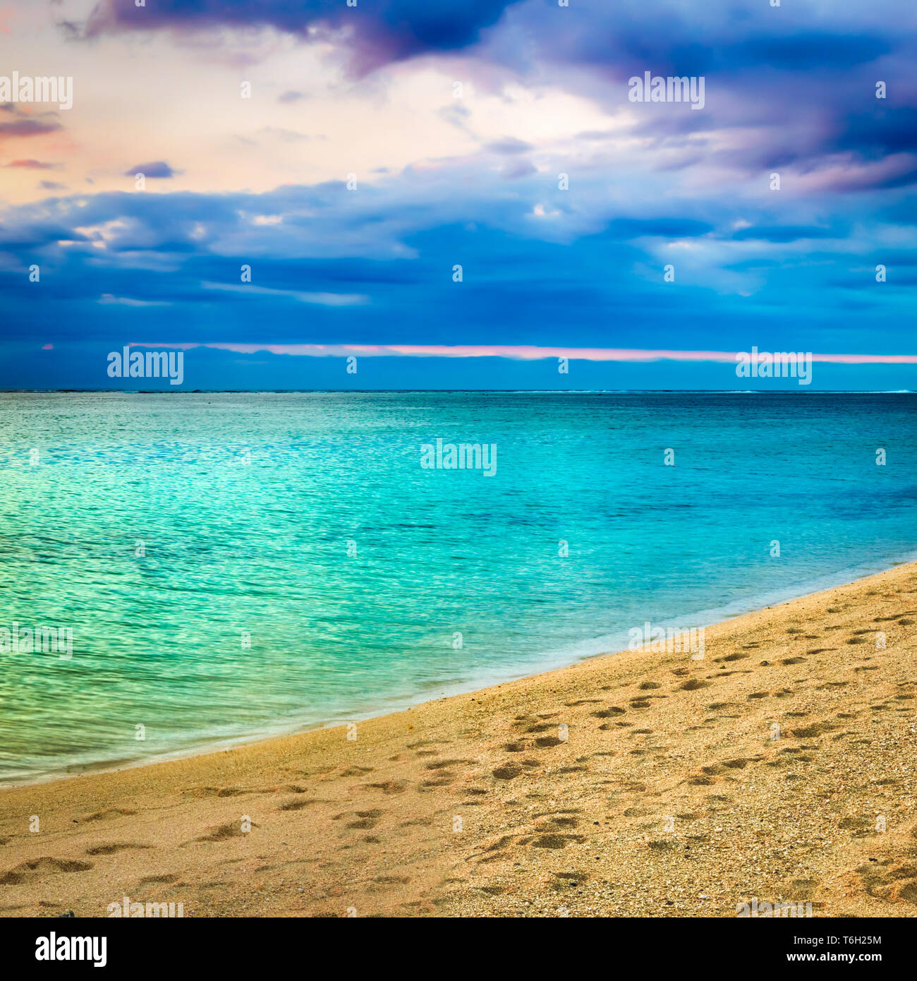 Beautiful sunset over sandy beach hi-res stock photography and images ...