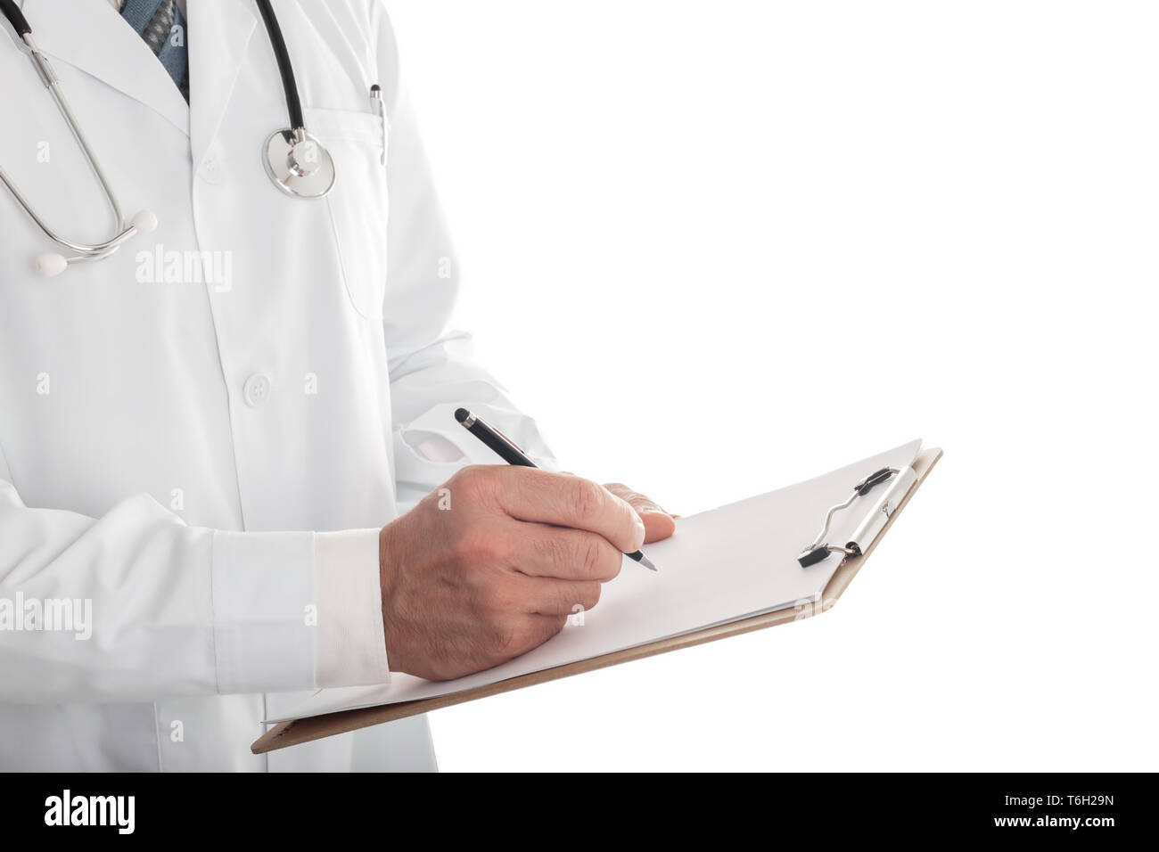 Doctor filling up medical form Stock Photo - Alamy