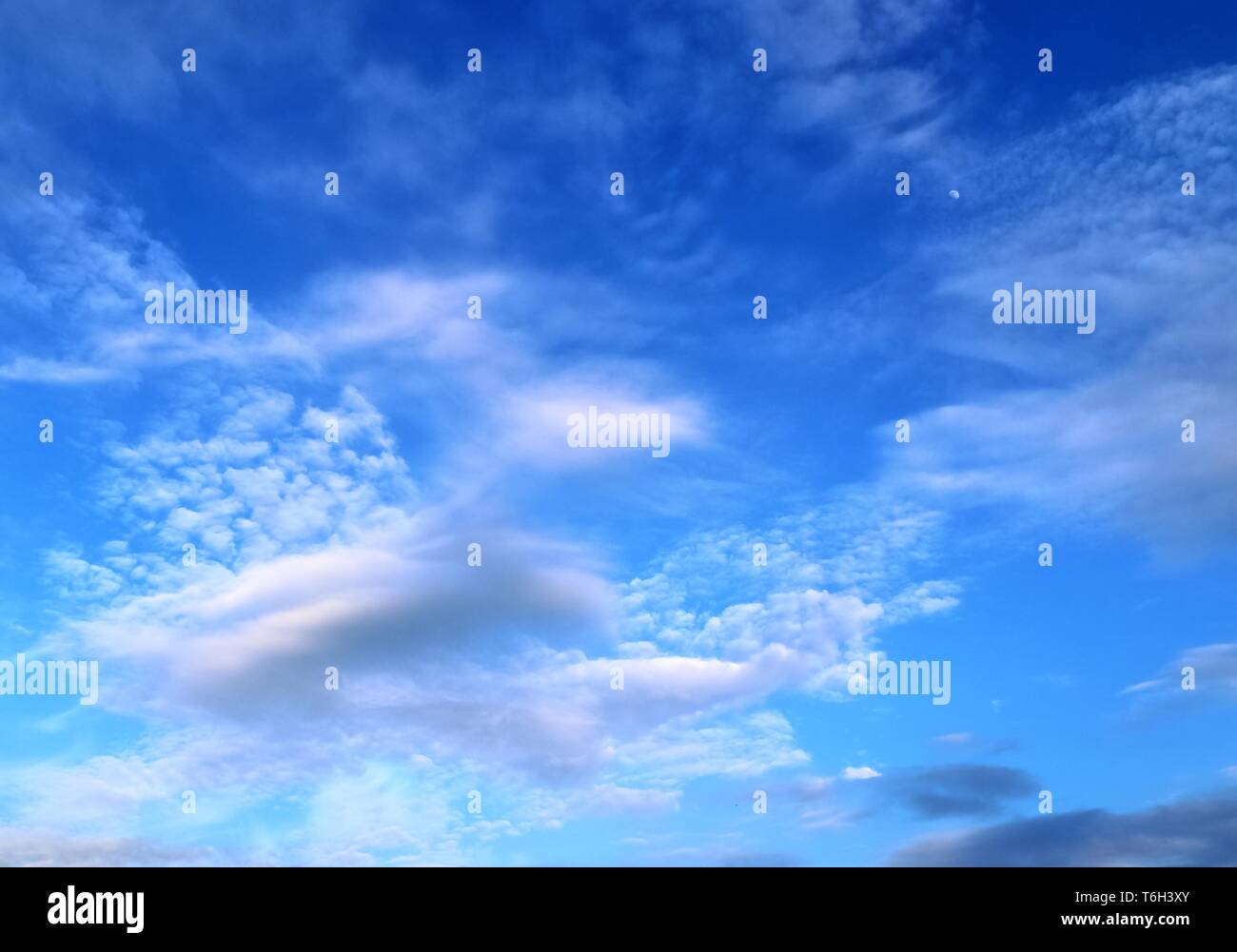 Beautiful mixed cloud formation with white and grey cumulus clouds in ...