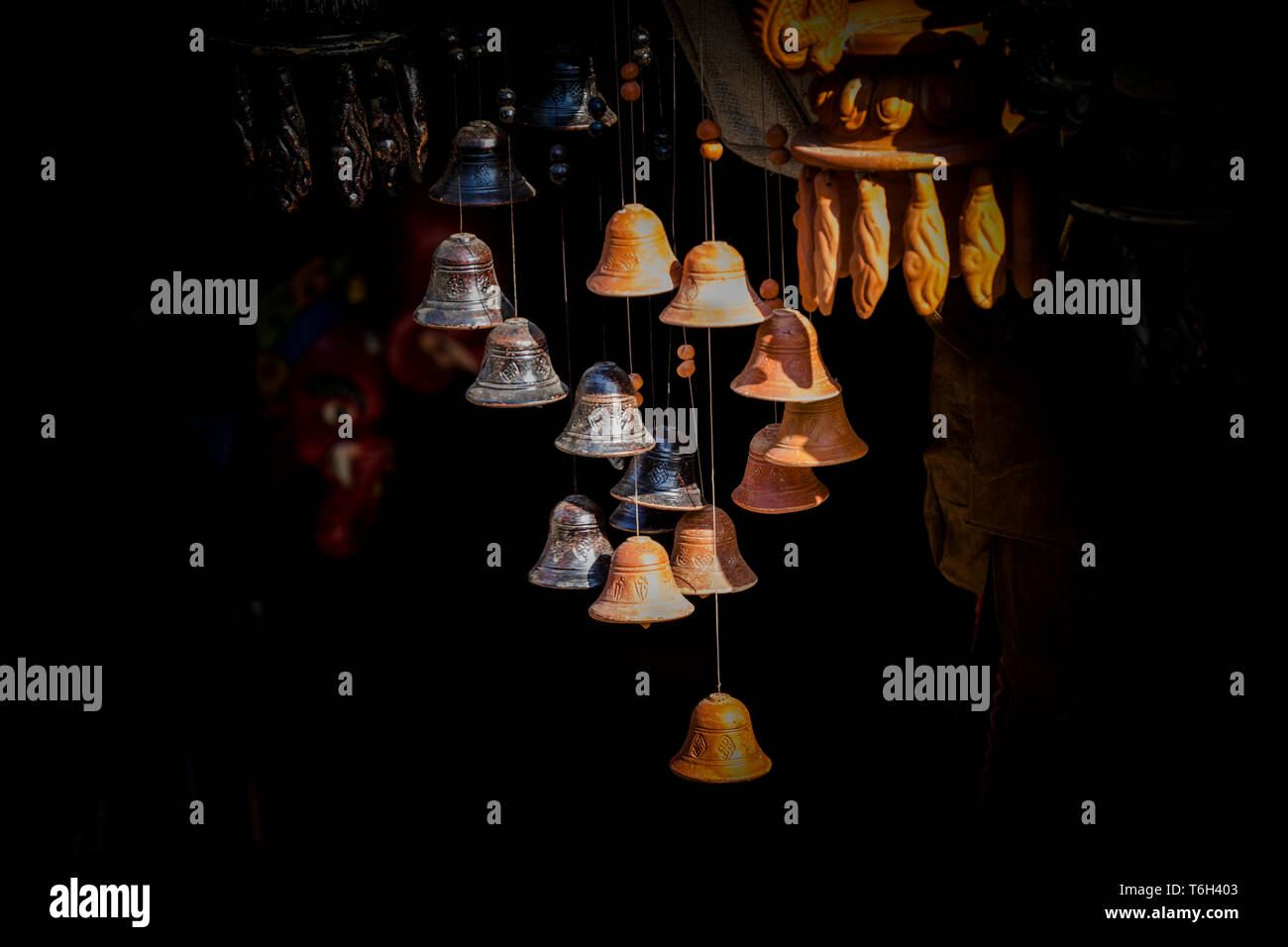 Beautiful small Clay hanging bells with Black background on street ...