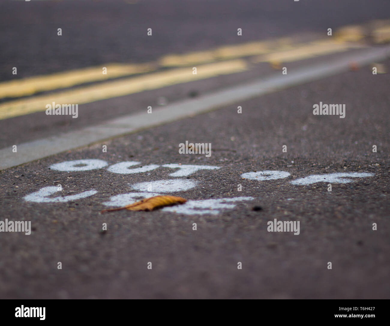 "Out of Use" road marking Stock Photo - Alamy