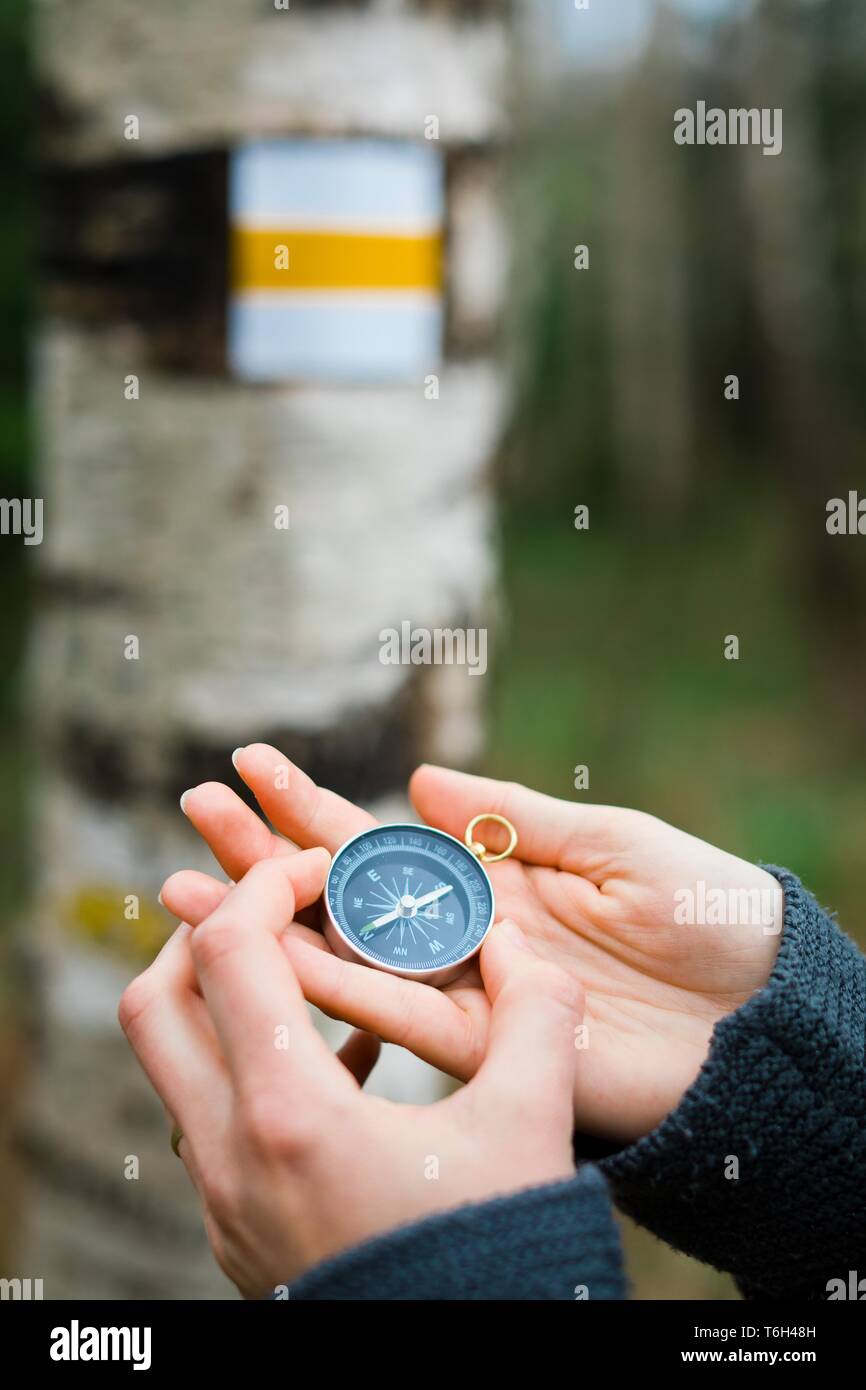 Woman using compass navigate hi-res stock photography and images - Alamy