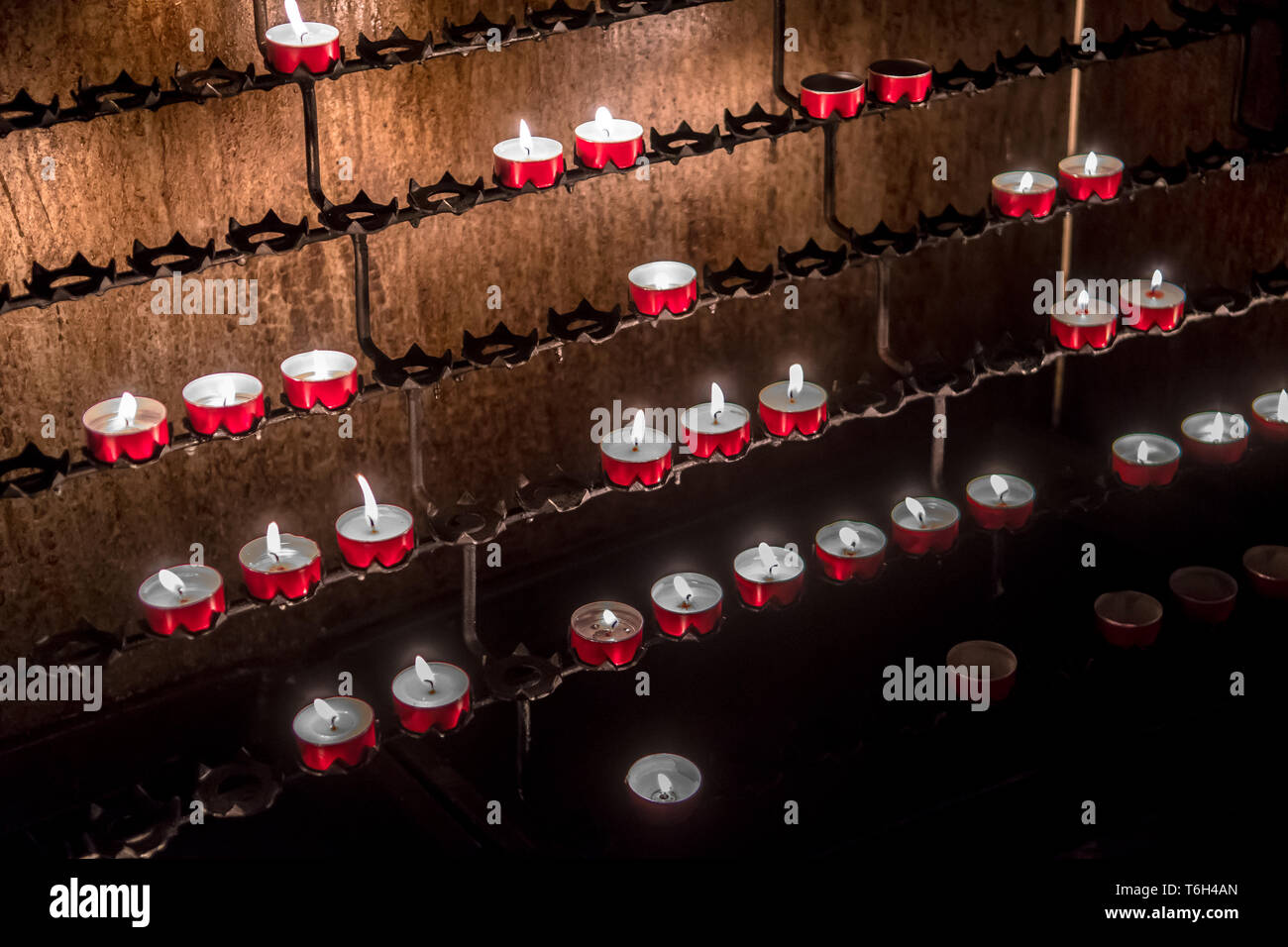 Red Memory Candles Burning In Chapel Stock Photo - Alamy