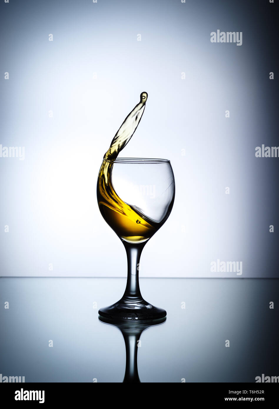 stream of wine being pouring into a glass closeup, wine, splashing ...