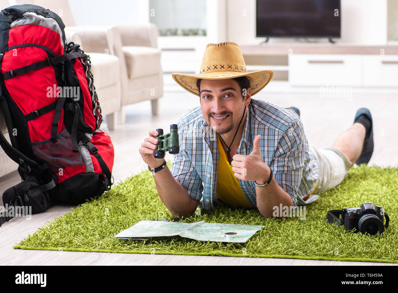 Man planning his travel with map Stock Photo - Alamy