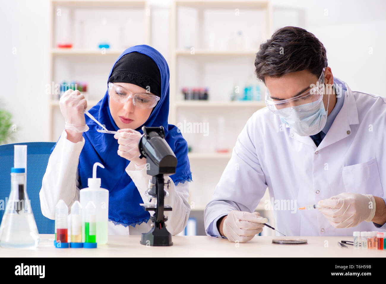 Two chemists working in the lab Stock Photo - Alamy