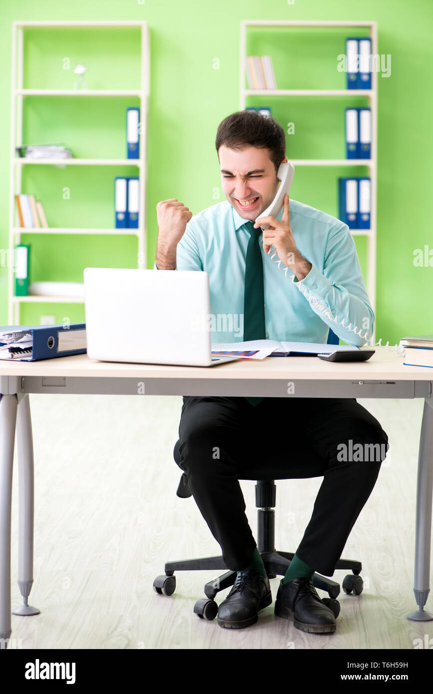 Male financial manager working in the office Stock Photo - Alamy