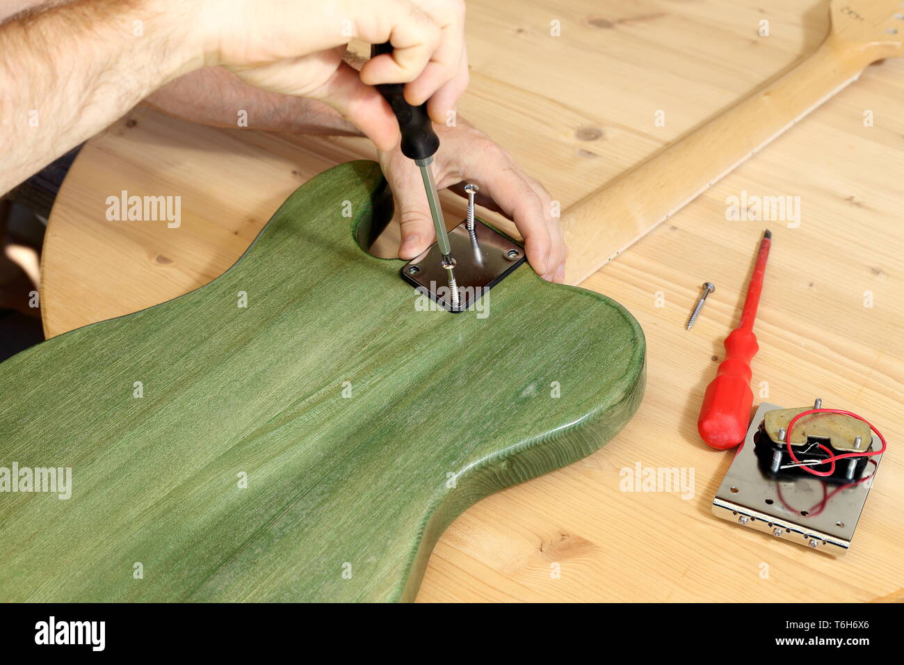 working on an electrical guitar Stock Photo - Alamy