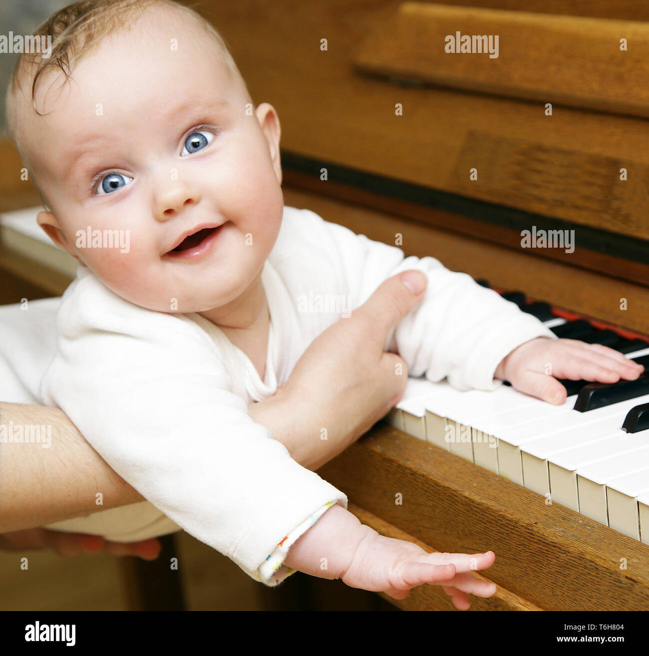 Old baby boy playing piano hi-res stock photography and images - Alamy