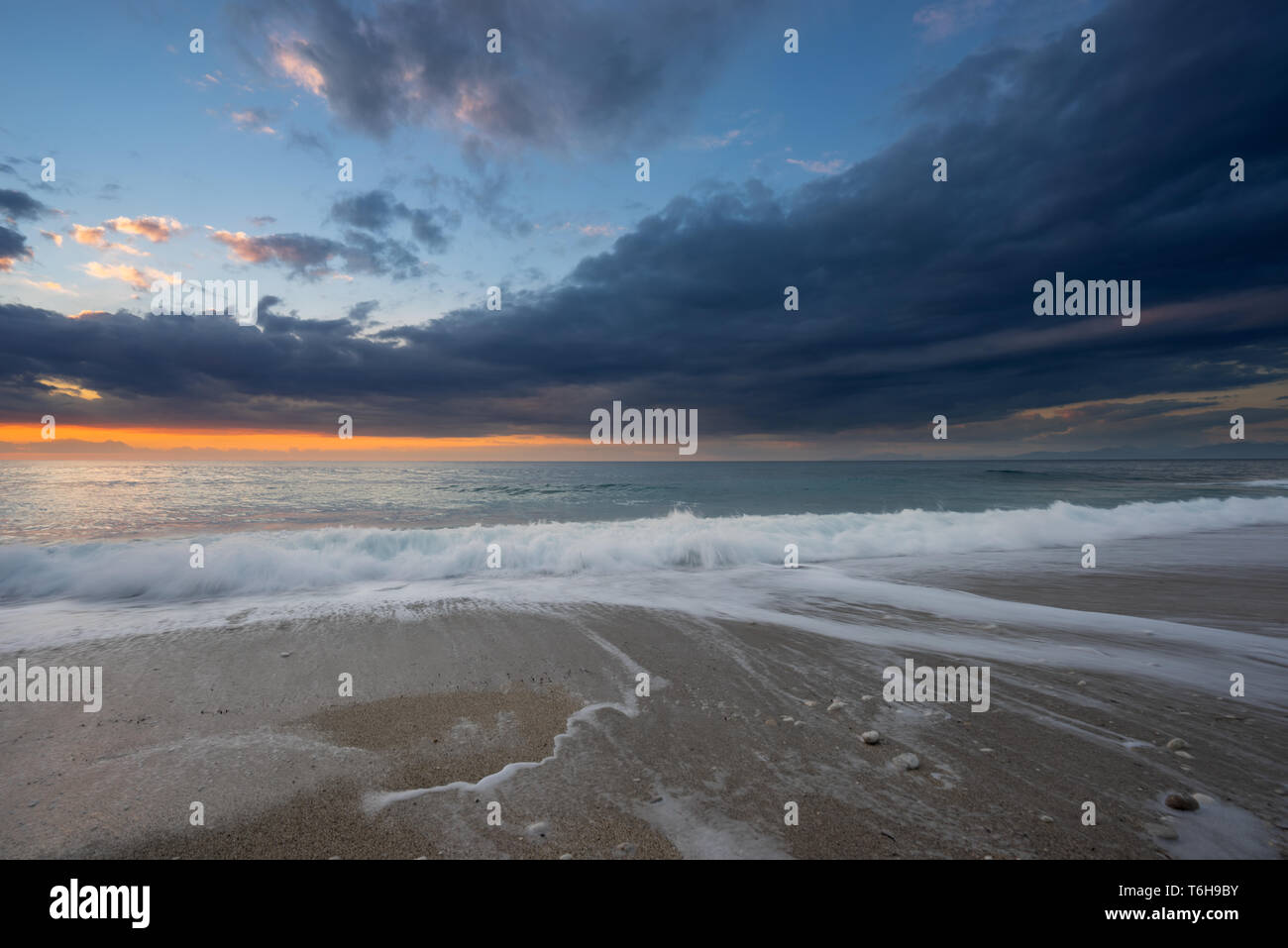 Sunset at the beach in Lefkas Greece Stock Photo - Alamy
