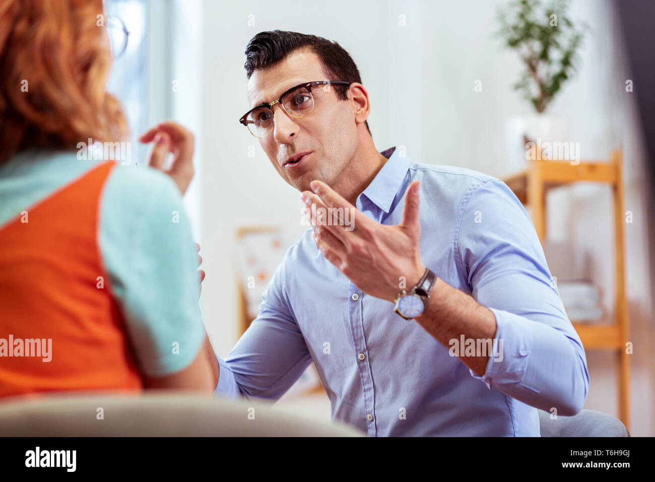 Pleasant good looking man conducting a lesson Stock Photo - Alamy